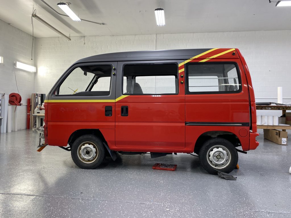 Red Micro Van Side In Process | NW Signs & Apparel